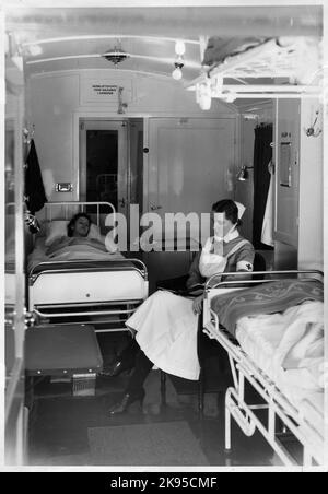 State Railways, SJ C10. Sick car 3rd grade. The nurse stands and talks ...
