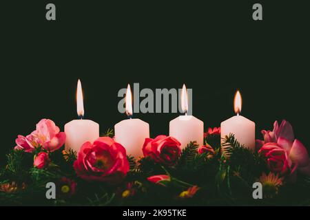 fourth burning advent candle on decorated rose flower pink advent ...
