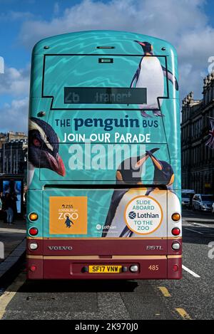 A Lothian Buses bus on Princes Street, Edinburgh with an advertisement ...