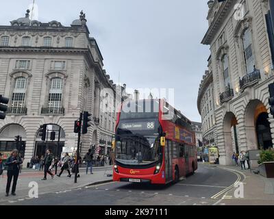 a Red bus along Piccadilly Circus in london,UK Stock Photo - Alamy