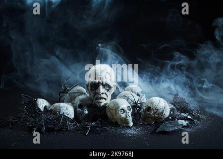 Halloween concept - black bats and skulls on black background Stock ...