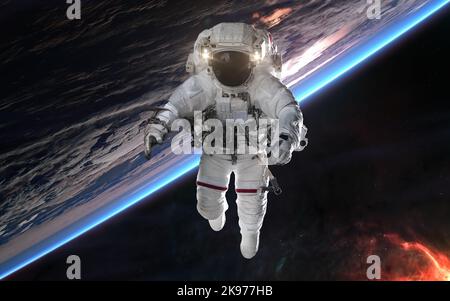 Astronaut in outer space orbiting planet Earth. Solar system Stock ...