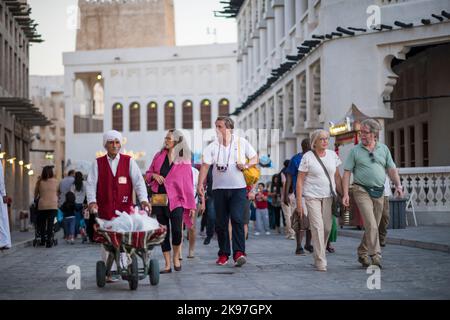 Doha, Qatar - March 05, 2019 : Tourists tour the old market Souk Waqif ...