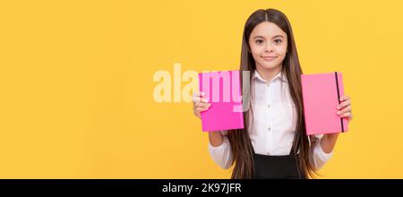 Teen girl pupil hold books, notebooks, isolated on yellow background ...