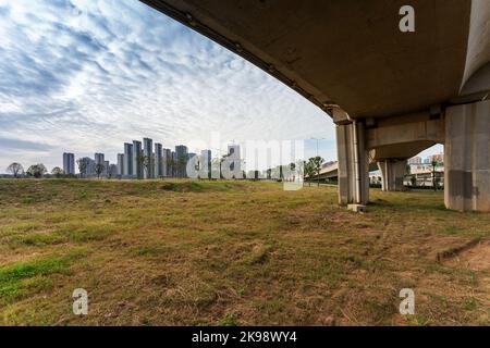 Grass under the overpass,Freeway, overpass and junction with green ...