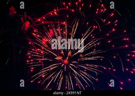 Bright, beautiful red fireworks in the night sky Stock Photo - Alamy