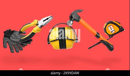Builder's headphones with set of professional supplies on light ...