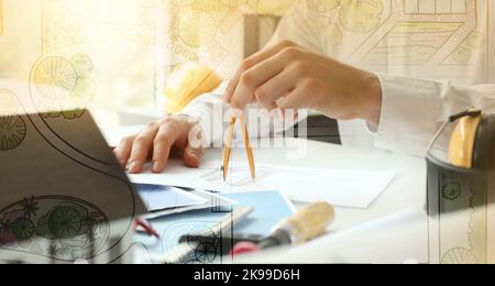 Double exposure of drawing and architect working at table, top view ...