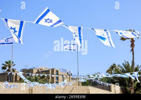 Flags of Israel hanging on city street Stock Photo - Alamy