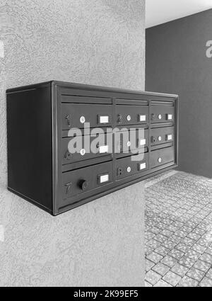 Modern mailboxes on grey wall in residential building Stock Photo - Alamy