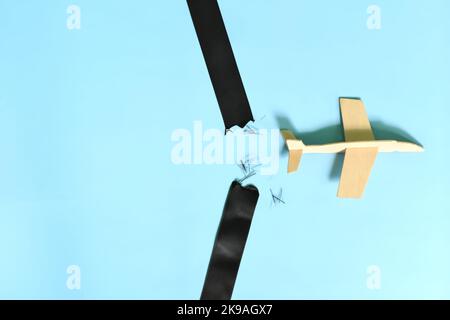 Breaking barriers and boundaries business concept. Airplane model break ...