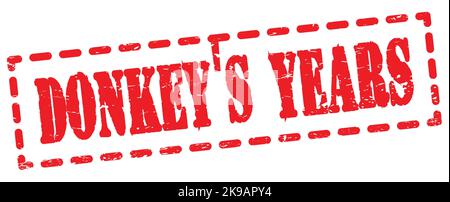 DONKEY'S YEARS text written on red rectangle stamp sign Stock Photo - Alamy