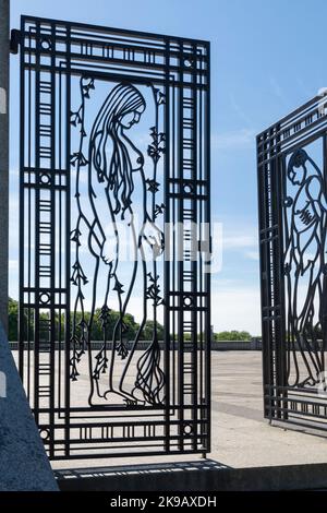 A half-open wrought iron gate leads down from the Monolith Plareau to ...