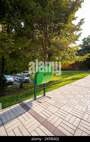 Park and dustbin in autumn Stock Photo - Alamy