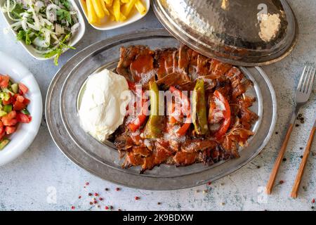 Turkish iskender kebab on gray background. Traditional flavors. Doner ...