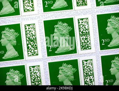Royal Mail second class postage stamps and an envelope with a stamp ...