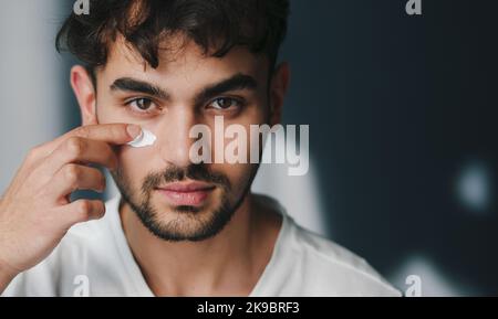 Face exfoliation. Cropped portrait of an attractive young woman ...