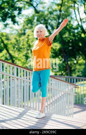 Young adults doing exercises with pilates ball Stock Photo - Alamy