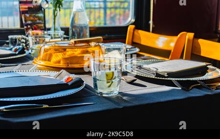 gourmet dinner served while beautiful Vermont landscape rolls by window ...