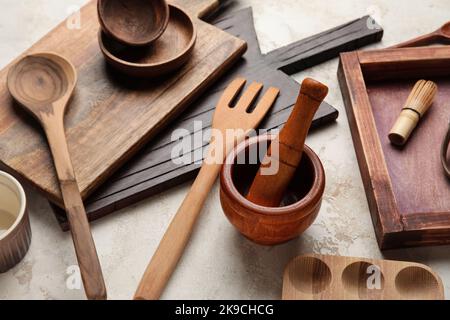 Wooden cooking utensils on grunge background Stock Photo - Alamy