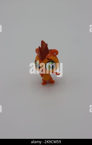 Tiny, cute plastic hedgehog animal figure on a white background ...