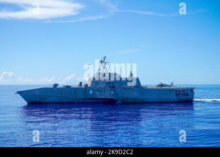 Littoral combat ship USS Jackson passes by the guided missile cruiser ...