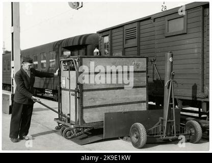 Work with height and lowerable platform trolley Stock Photo - Alamy