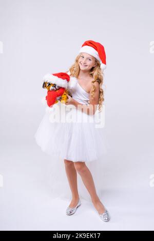 Photo of dreamy excited girl wear xmas green pullover embracing gift ...
