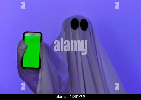 The ghost shows a phone with a green screen. Phone with chromakey. The ...