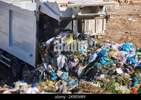 Truck unloading garbage on an open air dump. Waste recycling Stock ...