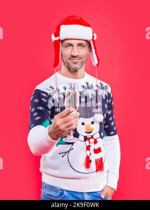 positive man in sweater and earflap on red background, fashion. Man ...