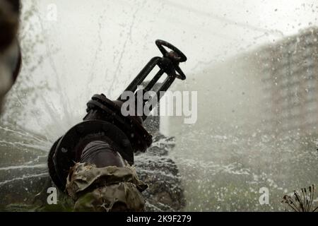 Pipeline accident. Water pours from well. Torn valve. Emergency Stock ...