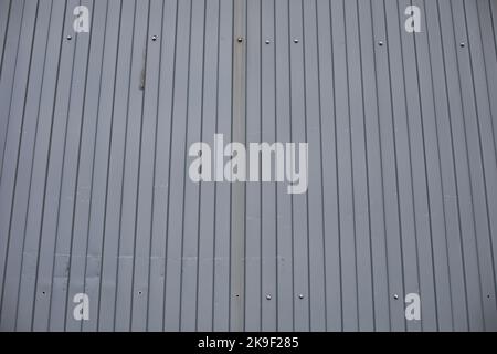 Grey steel wall. Steel profile with stiffeners. Metal cladding on house ...