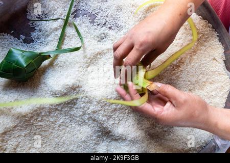 Making hanging rice popularly called puso is a staple in Cebu ...
