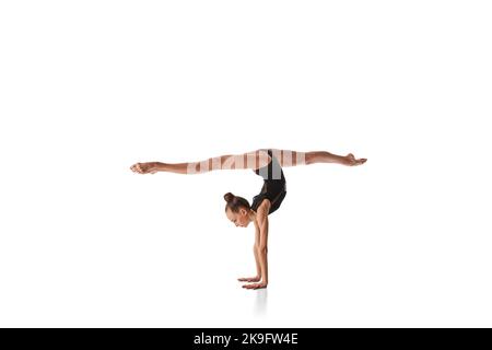 Gymnast doing hand stand isolated on white background. Royal blue pants ...