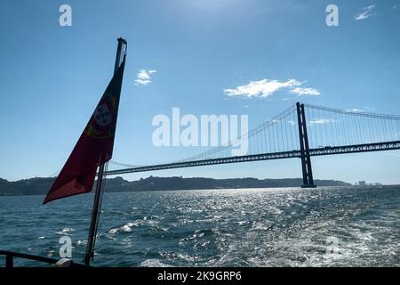 Portuguese flag with Bridge of 25th April Stock Photo - Alamy