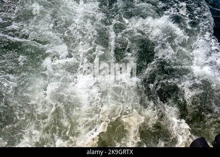 A powerful waves shot from a fast moving boat Stock Photo - Alamy