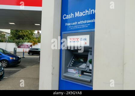 London- October 2022: Tesco Bank cash machine at a Tesco Esso petrol ...