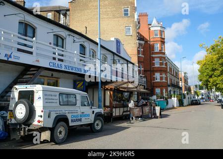London- October 2022: Putney riverfront by Putney Pier and rowing club ...