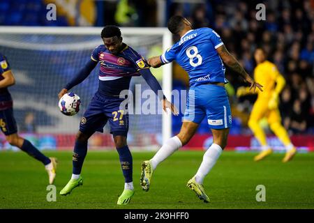 Birmingham City's Ethan Laird (left) and Huddersfield Town's Radinio ...