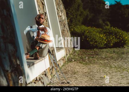 Bald, bearded black man, having a great time while riding an electric ...