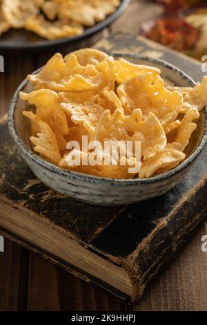 Halloween crispy bat shaped chips in the bowl Stock Photo - Alamy