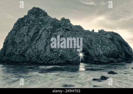 Keyhole Rock, a large, rugged rock formation with a natural archway ...