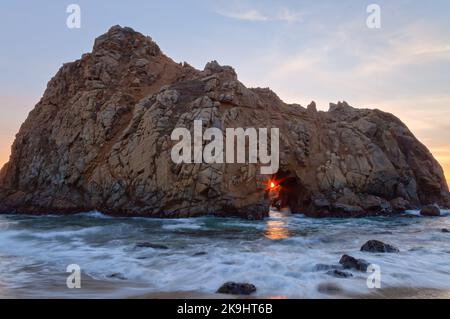 Keyhole Rock, a large, rugged rock formation with a natural archway ...