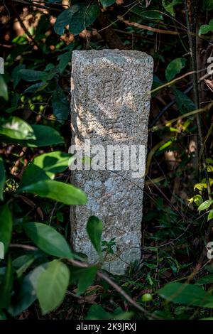 Ancient route marker signpost carved stone with hand symbol Stock Photo ...