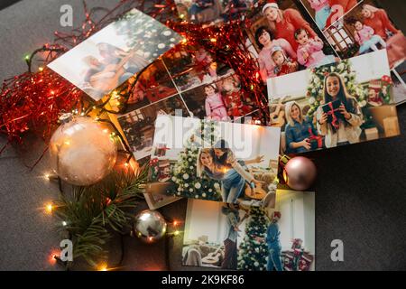Photos of family against Christmas lights decor background Stock Photo ...