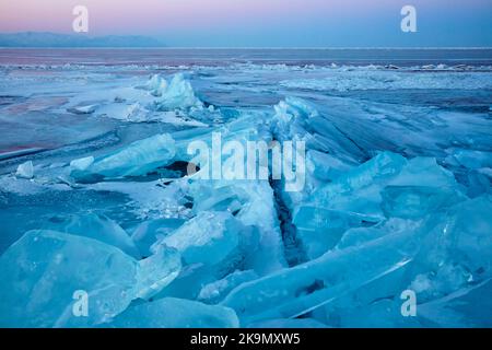 Piled up ice blocks on lake Baikal Stock Photo - Alamy