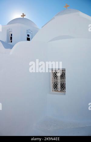 Typical white greek Chapelle with Gloriole light behind Stock Photo - Alamy