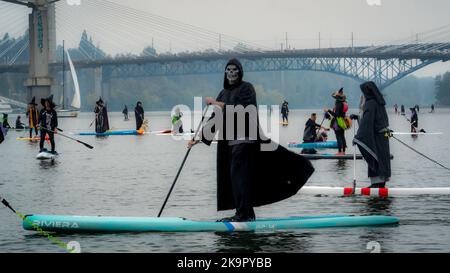 A coven of witches on Stand Up Paddle boards celebrate Halloween in ...
