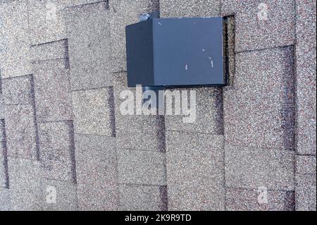 Static vent installed on a shingle roof for passive attic ventilation ...